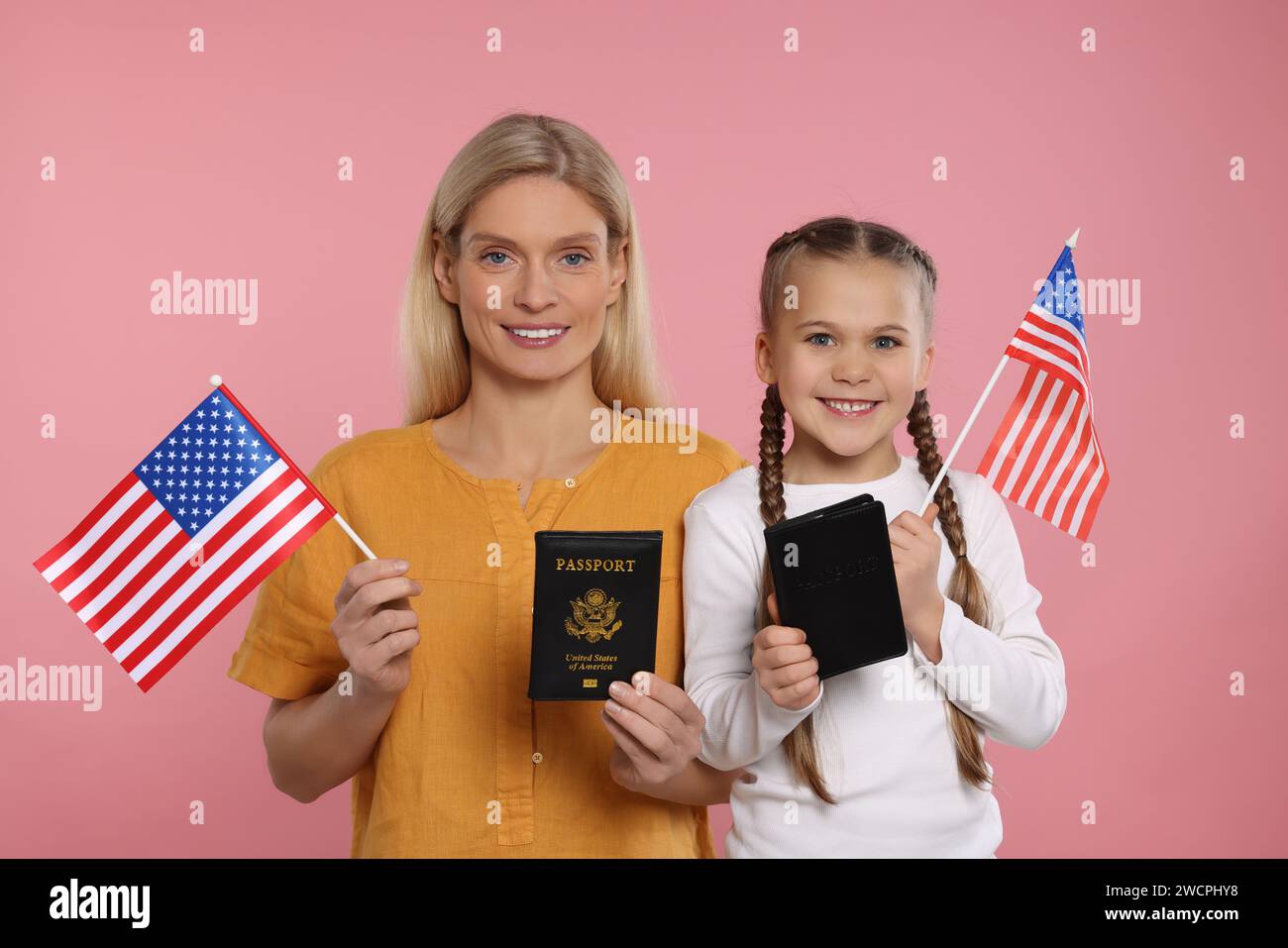Immigration. Happy woman with her daughter holding passports and ...