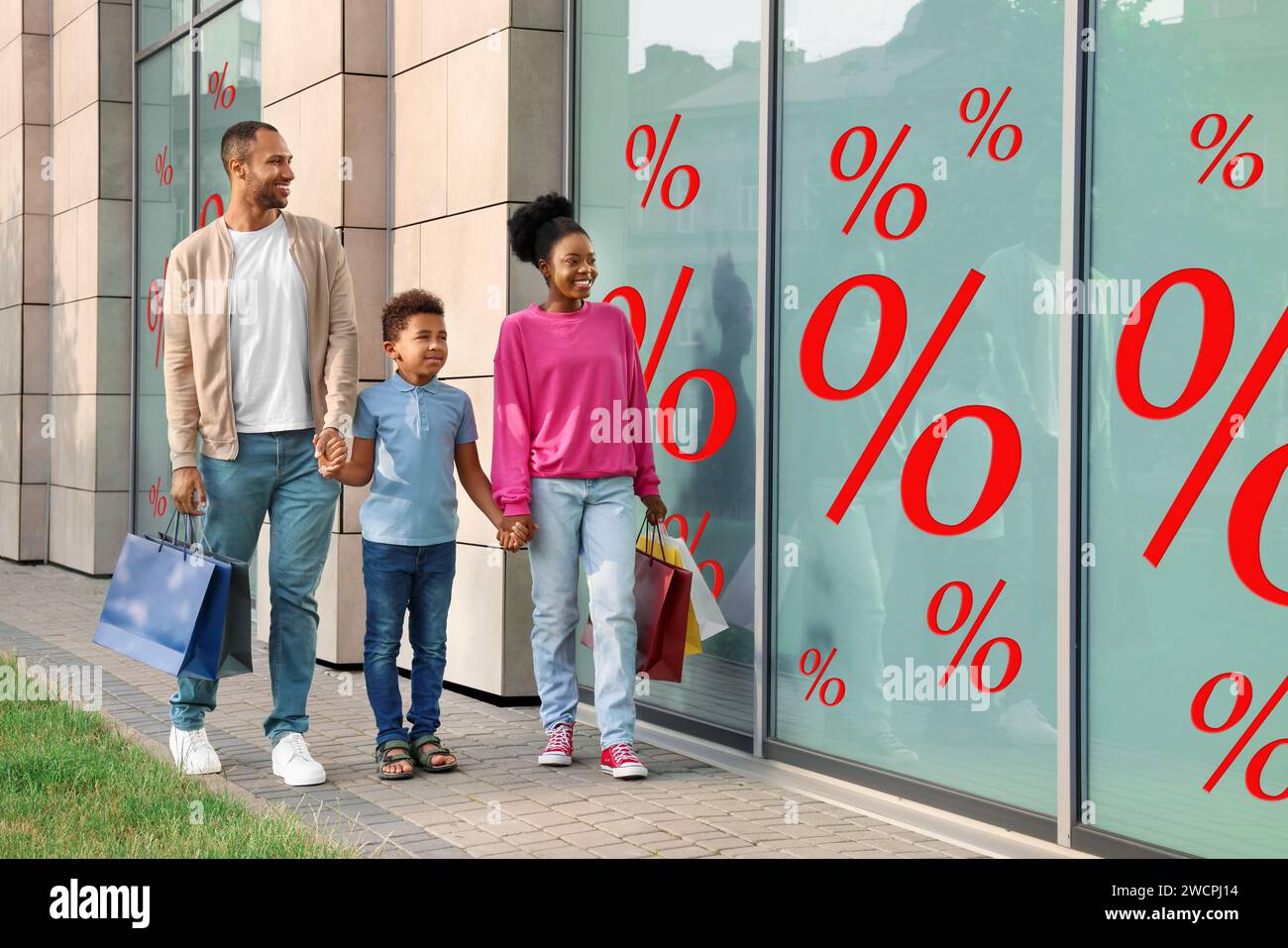 Discount offer. Family with shopping bags walking to store. Window ...