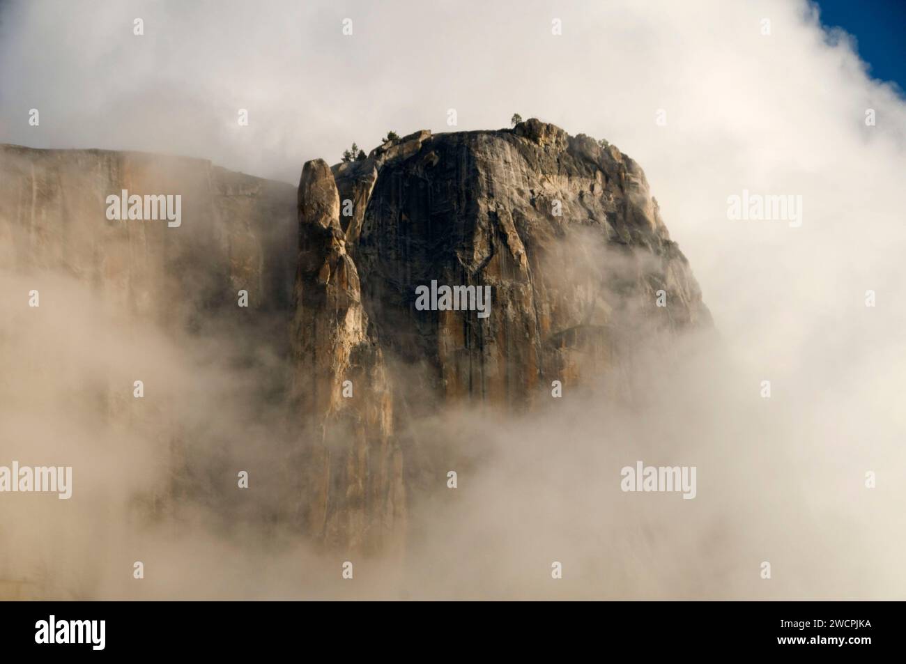 Cliff in clouds from Yosemite Falls Trail, Yosemite National Park ...