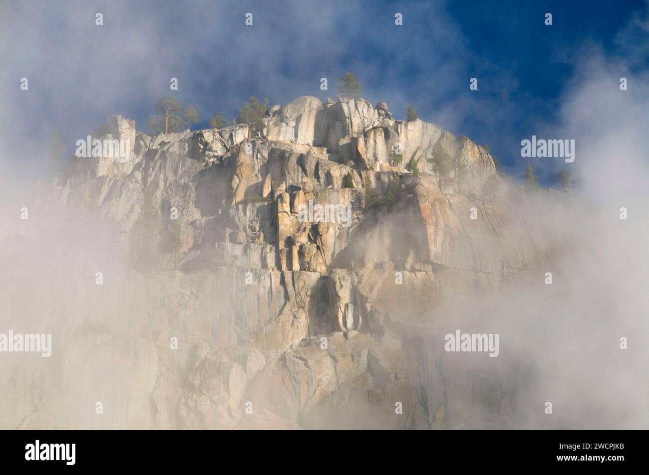 Cliff in clouds from Yosemite Falls Trail, Yosemite National Park ...