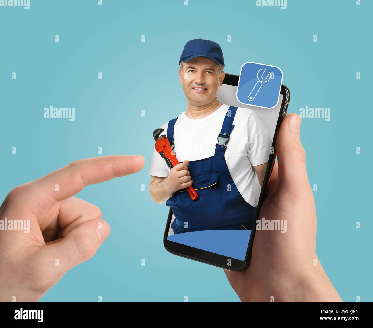 Find plumber. Man using mobile phone on light blue background, closeup ...