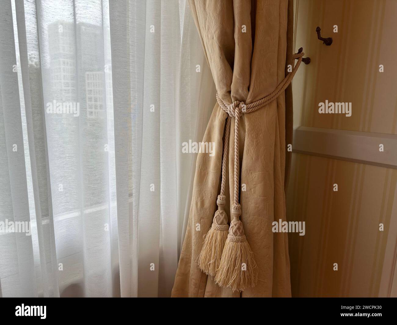 Window with beautiful beige curtain indoors. Interior element Stock ...