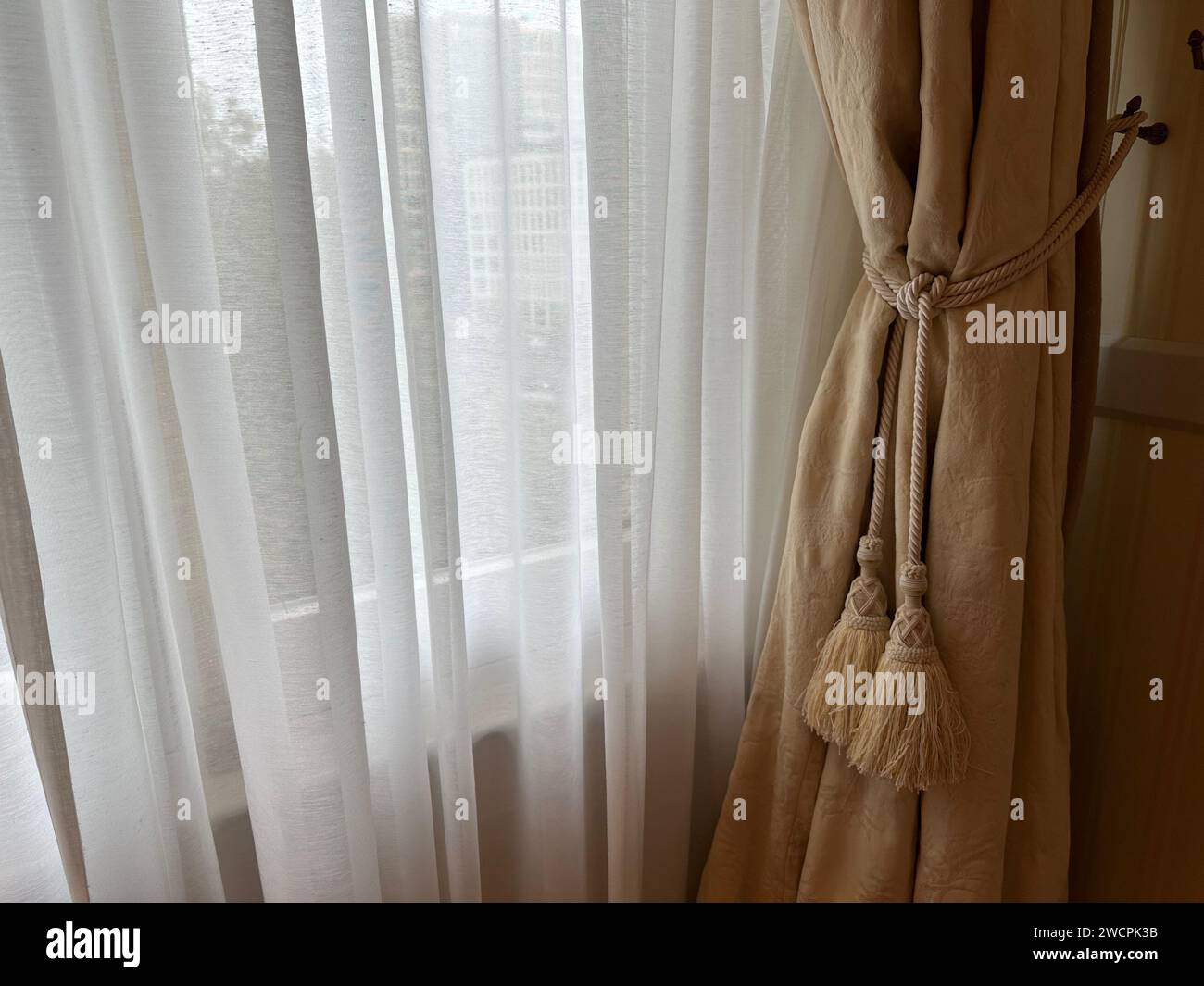 Window with beautiful beige curtain indoors. Interior element Stock ...