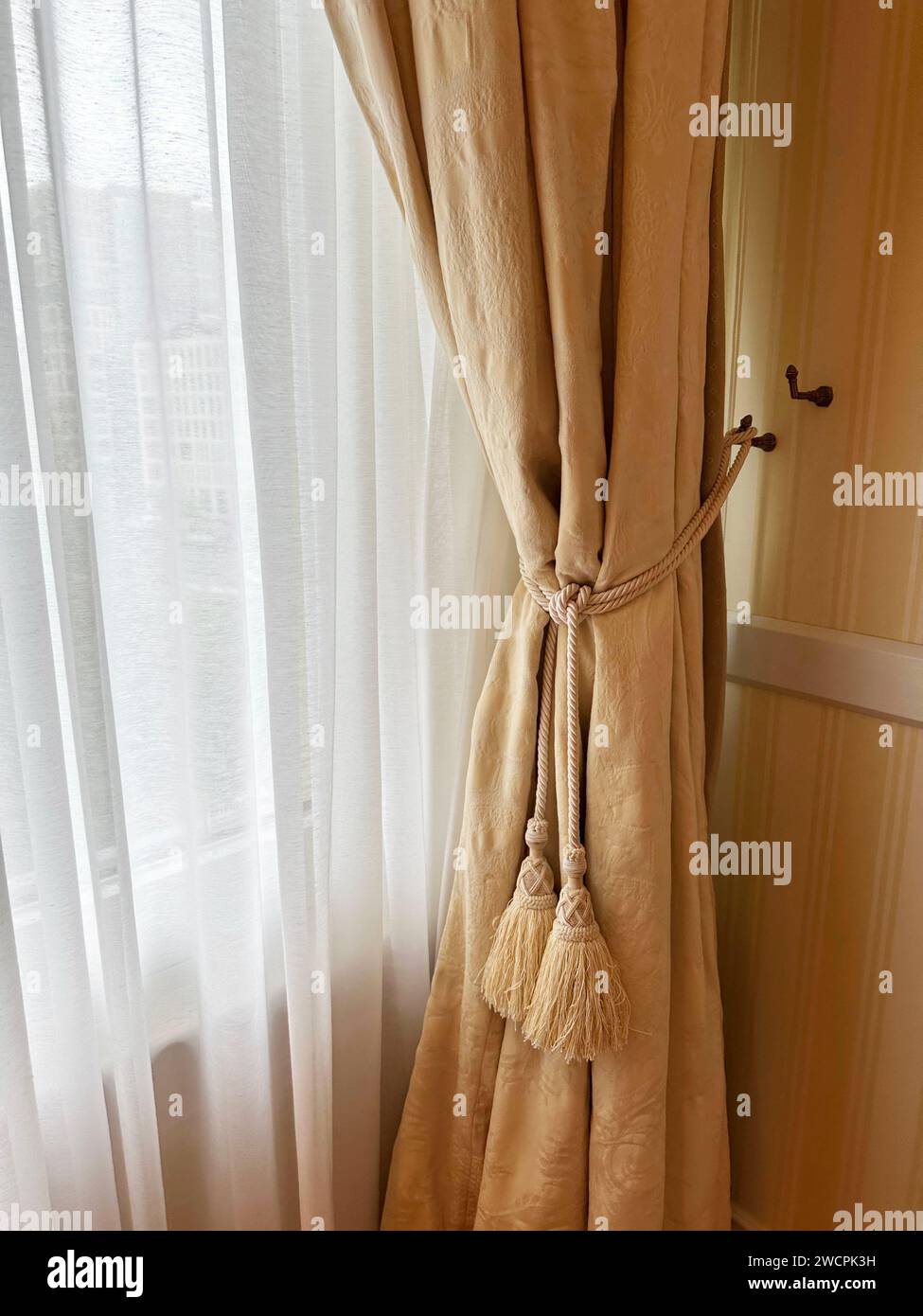 Window with beautiful beige curtain indoors. Interior element Stock ...