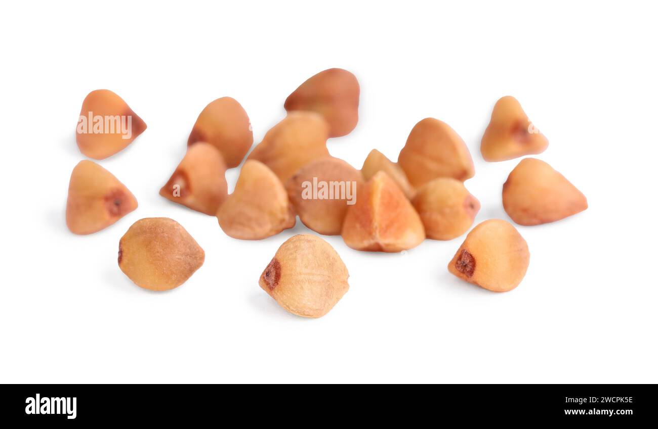 Many dry buckwheat grains isolated on white Stock Photo - Alamy