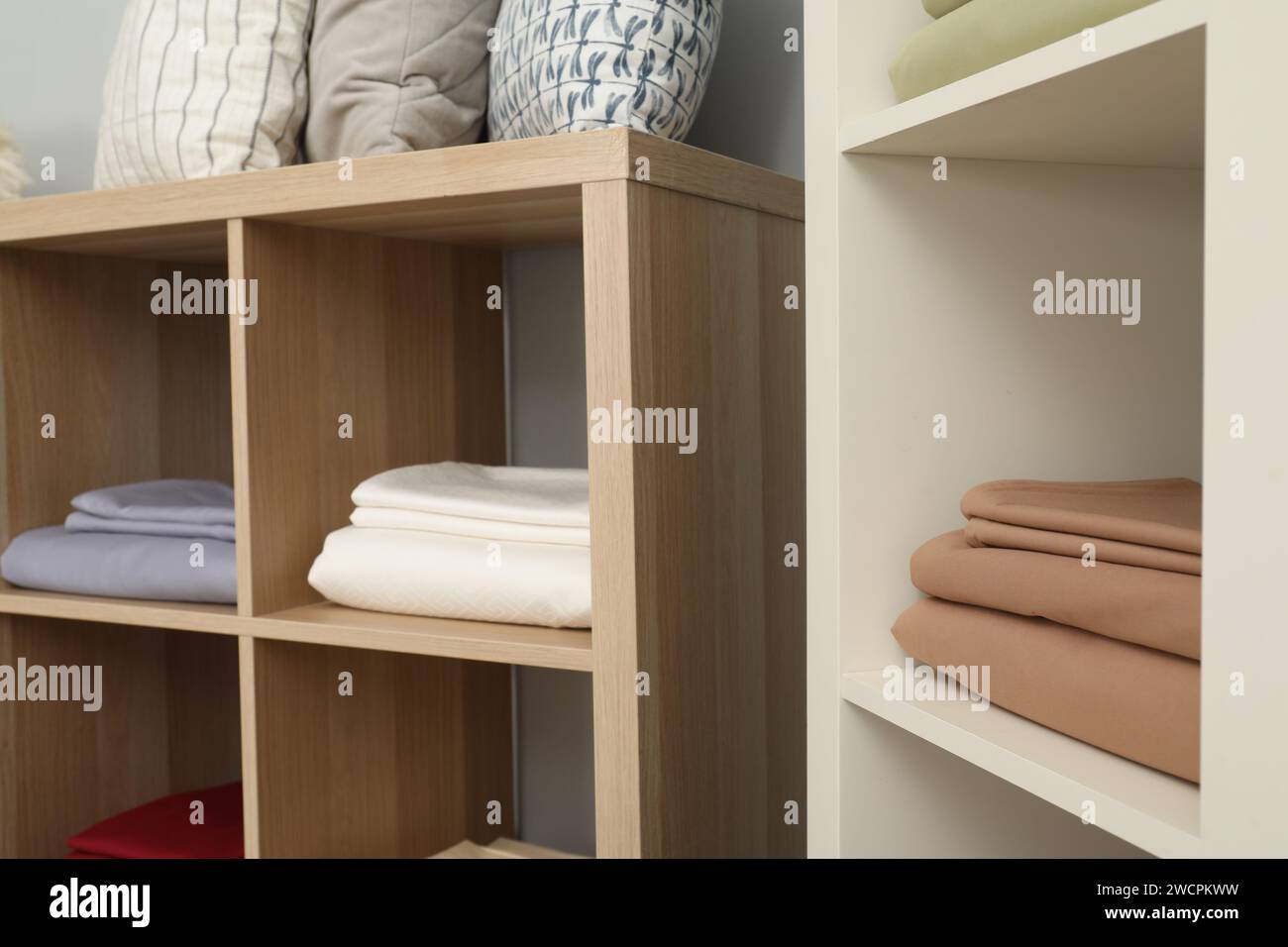 Different colorful bed linens on display in home textiles store Stock ...