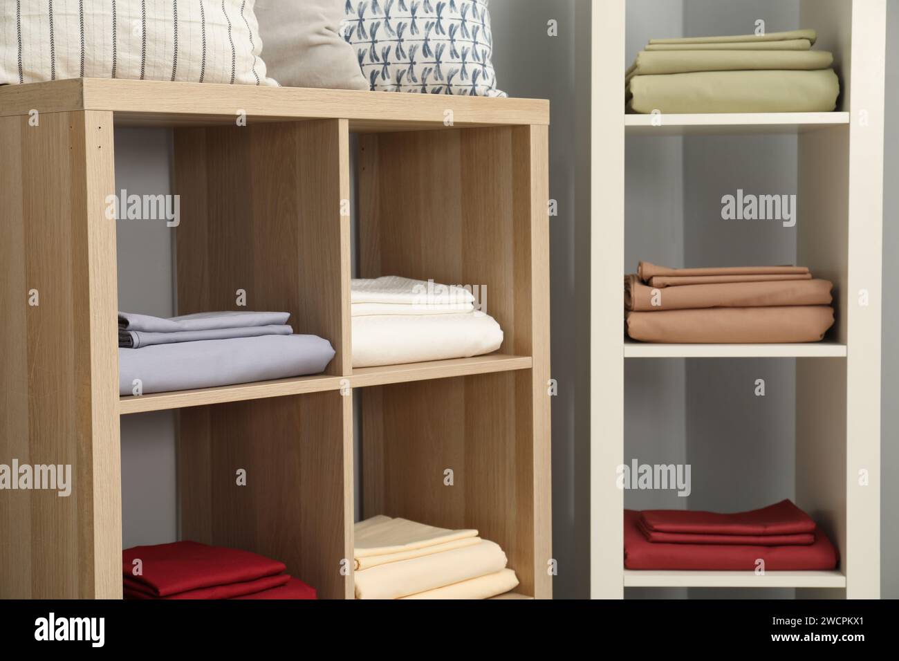 Different colorful bed linens on display in home textiles store Stock ...