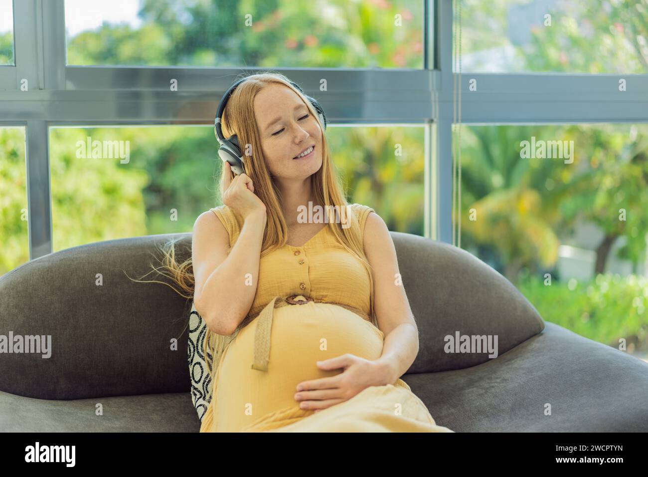 Expectant mom finds joy in her pregnancy, listening to soothing music ...