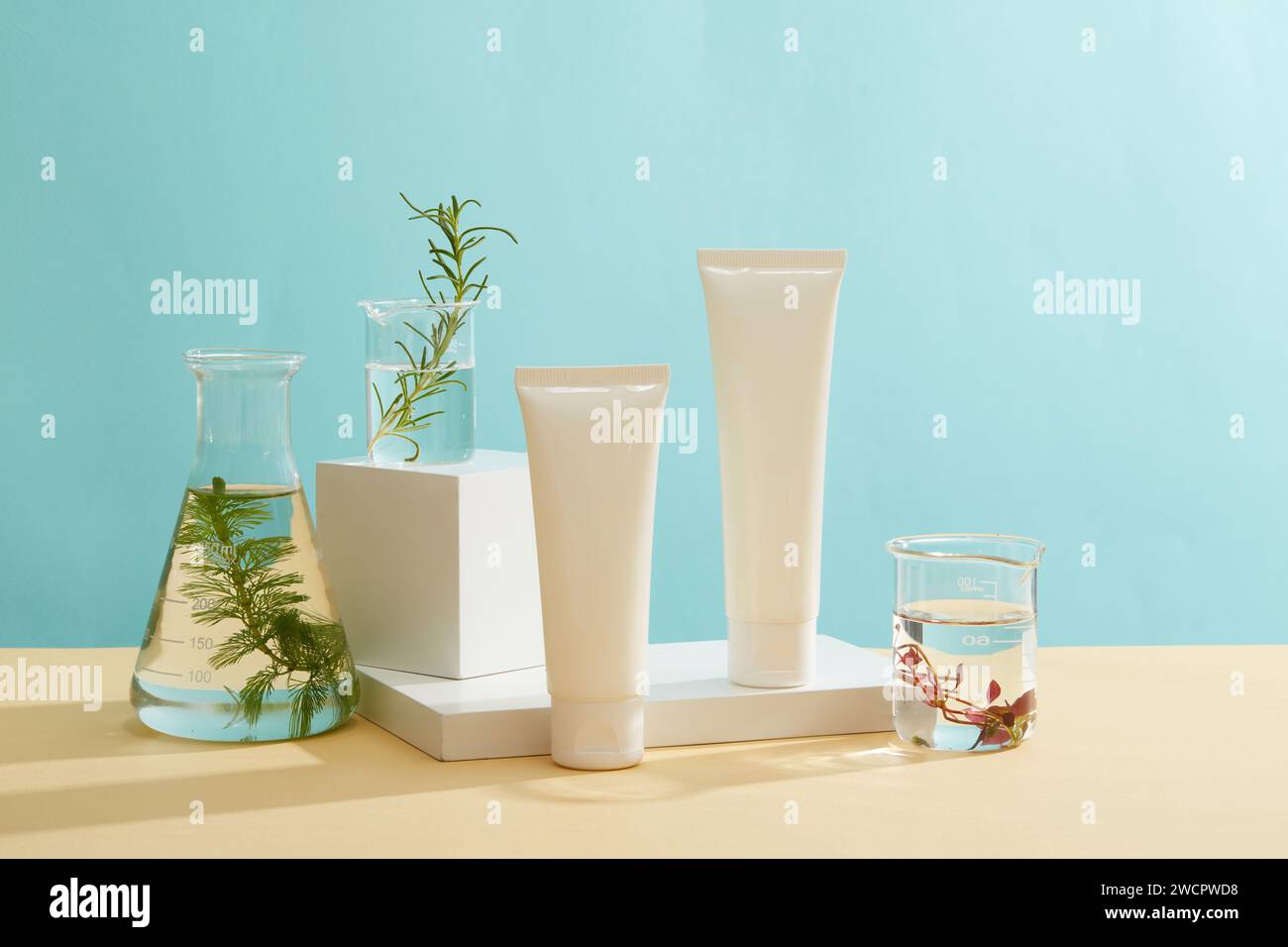 White tubes without label displayed with beakers and a conical flask ...