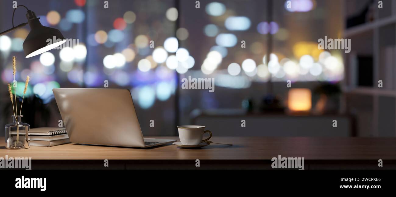 Back view of an office desk with a laptop computer, a table lamp, and ...
