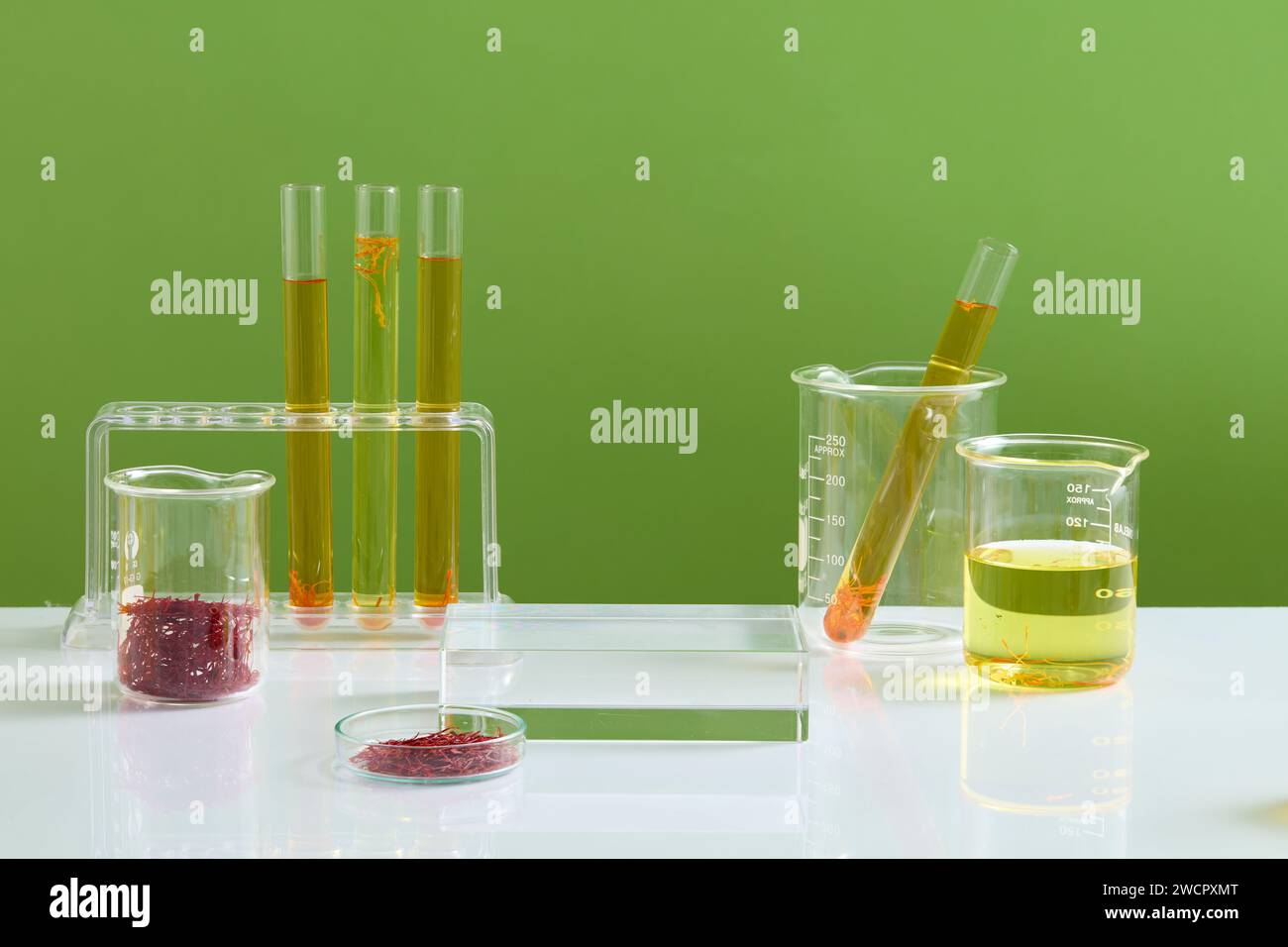 Rectangle podium displayed with some test tubes and beakers on green ...
