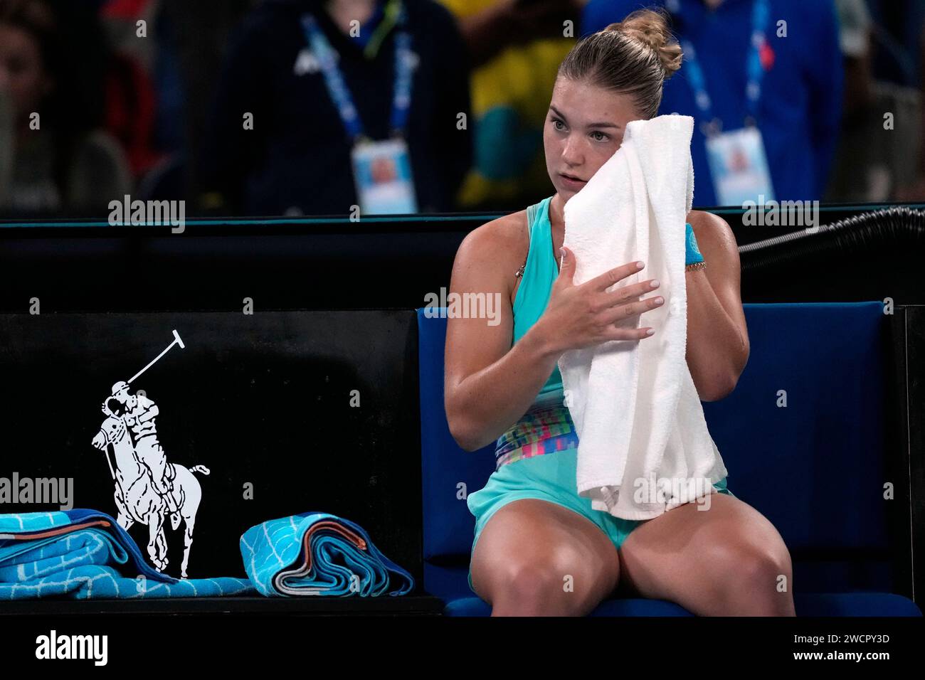 Maria Timofeeva of Russia wipes the sweat from her face during her ...
