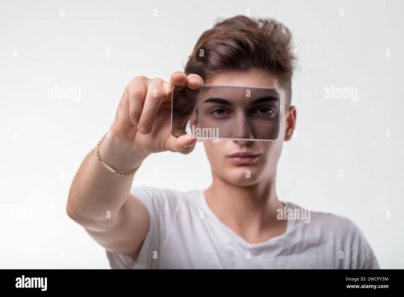 Man's eyes are intriguingly magnified by glass, creating a unique ...