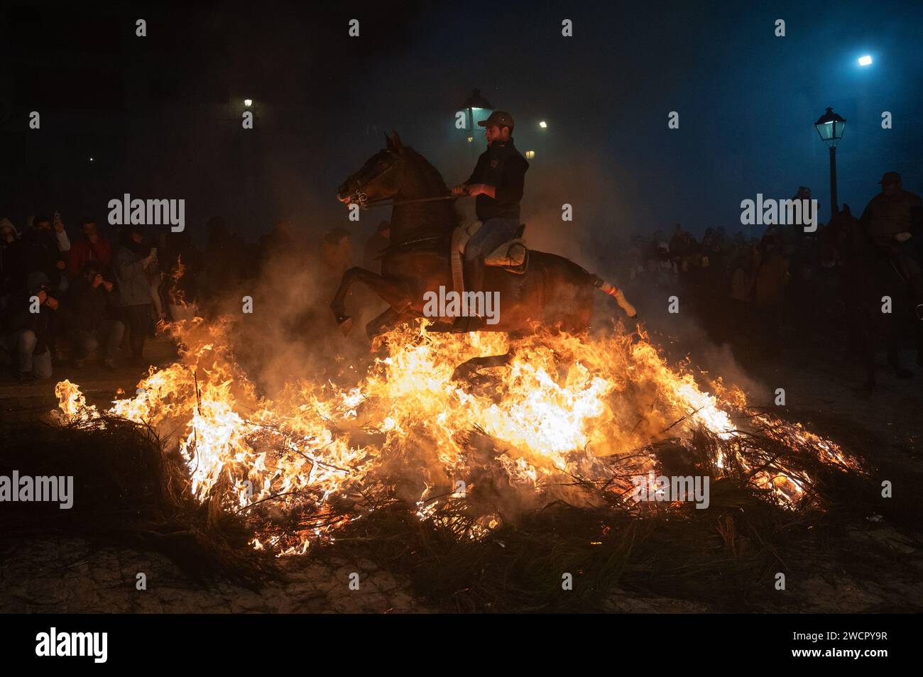 San Bartolome De Pinares, Spain. 16th Jan, 2024. A horse rider jumps ...
