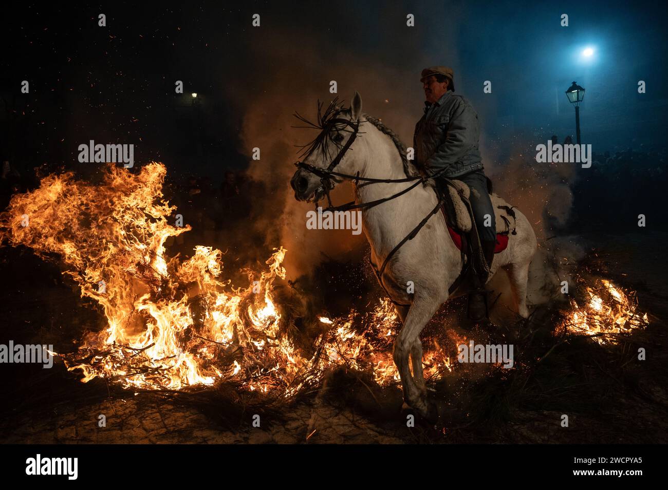 San Bartolome De Pinares, Spain. 16th Jan, 2024. A horse rider jumps ...