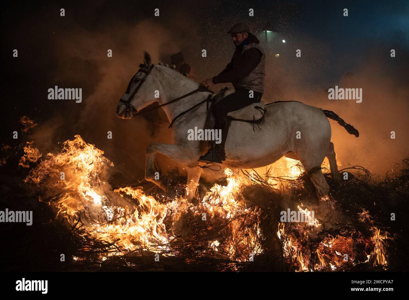 San Bartolome De Pinares, Spain. 16th Jan, 2024. A horse rider jumps ...