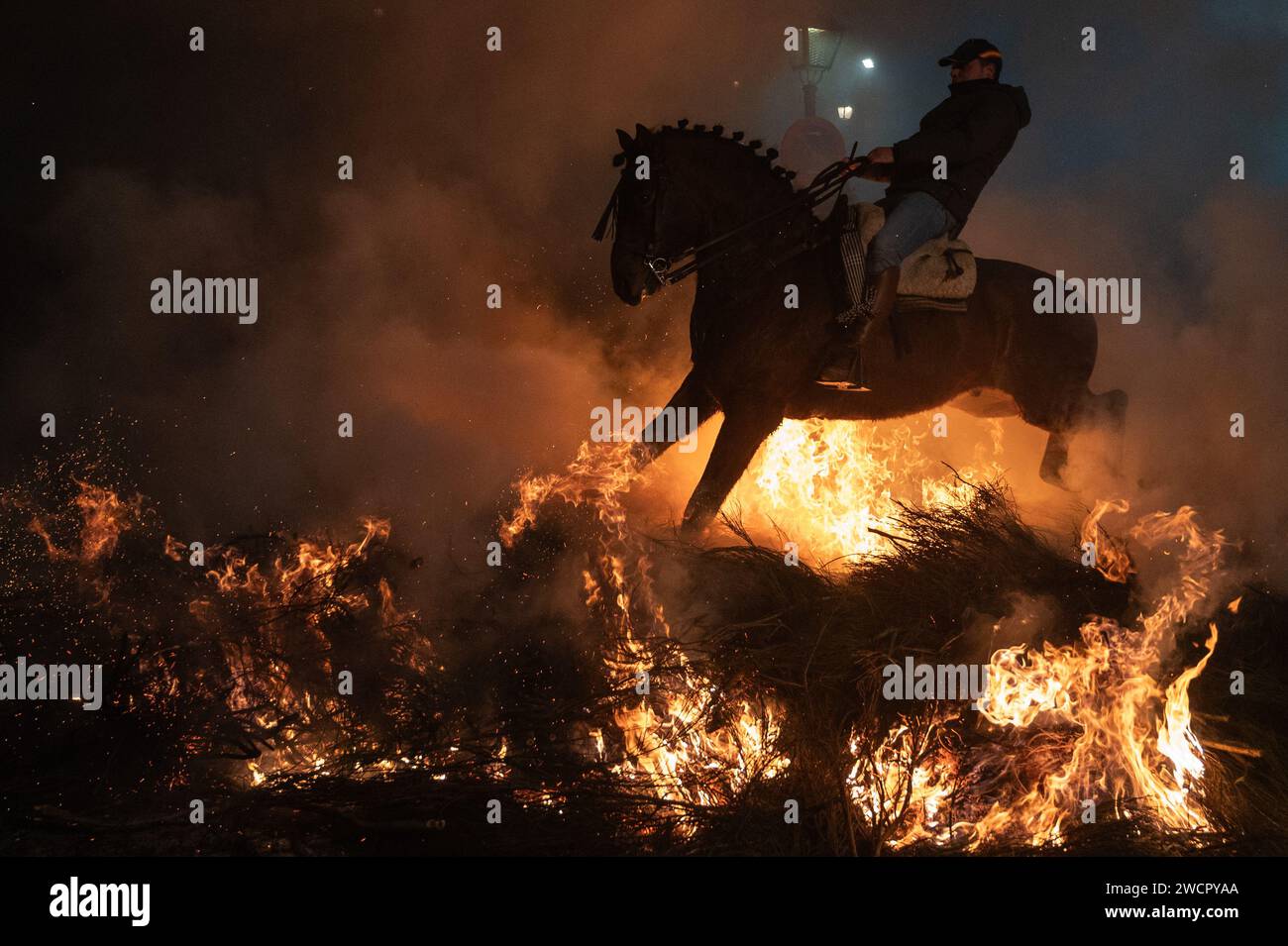 San Bartolome De Pinares, Spain. 16th Jan, 2024. A horse rider jumps ...