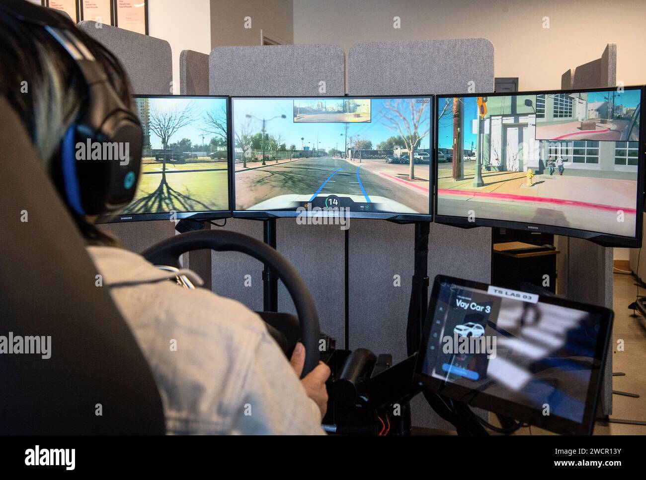 Las Vegas, USA. 11th Jan, 2024. A tele-driver drives a vehicle from the ...