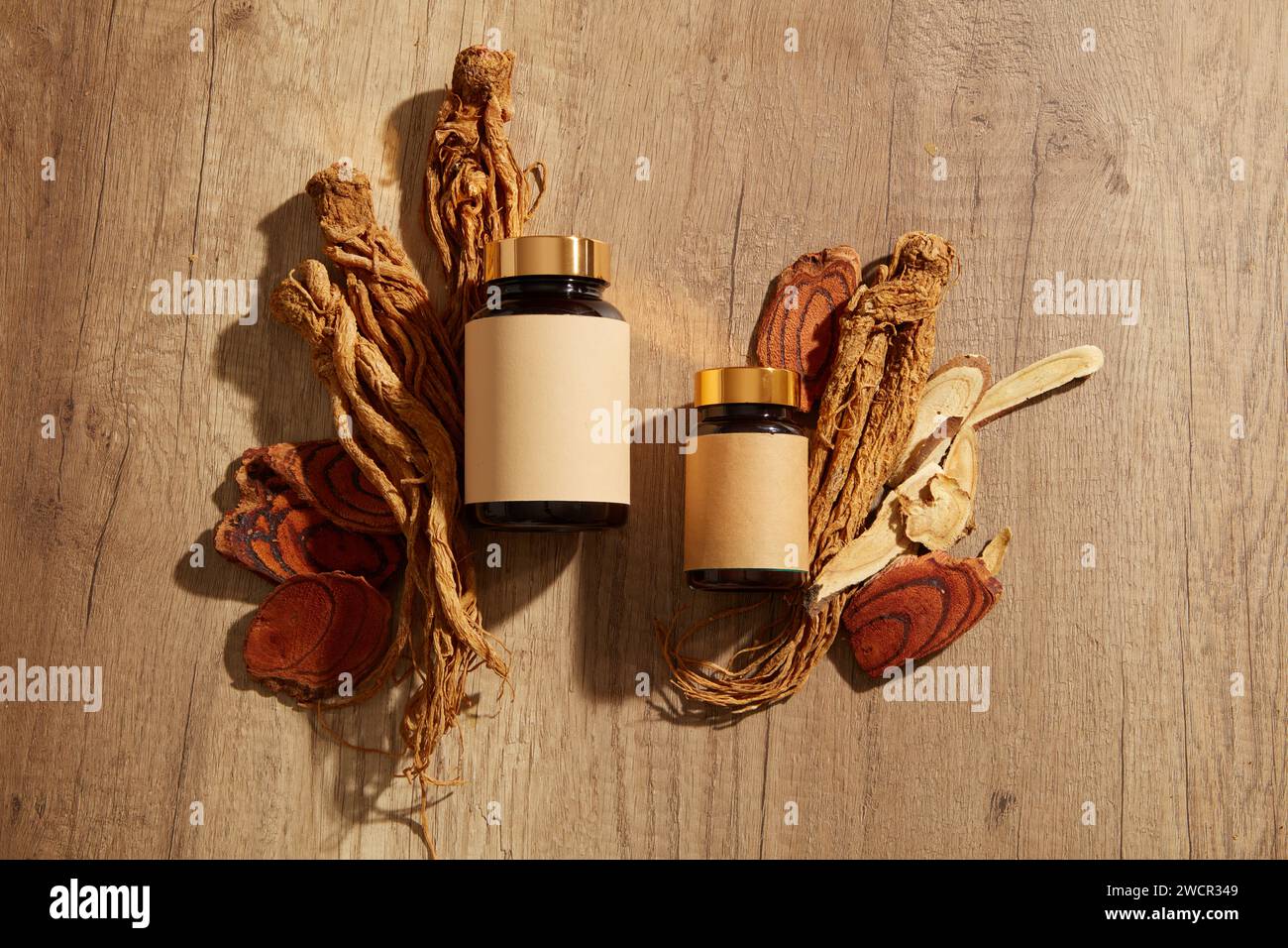 Medicine jars in different sizes are displayed with Bai zhu and ...