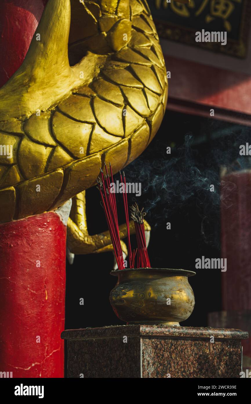 the burning incense near the temple entrance, used for prayer ritual ...