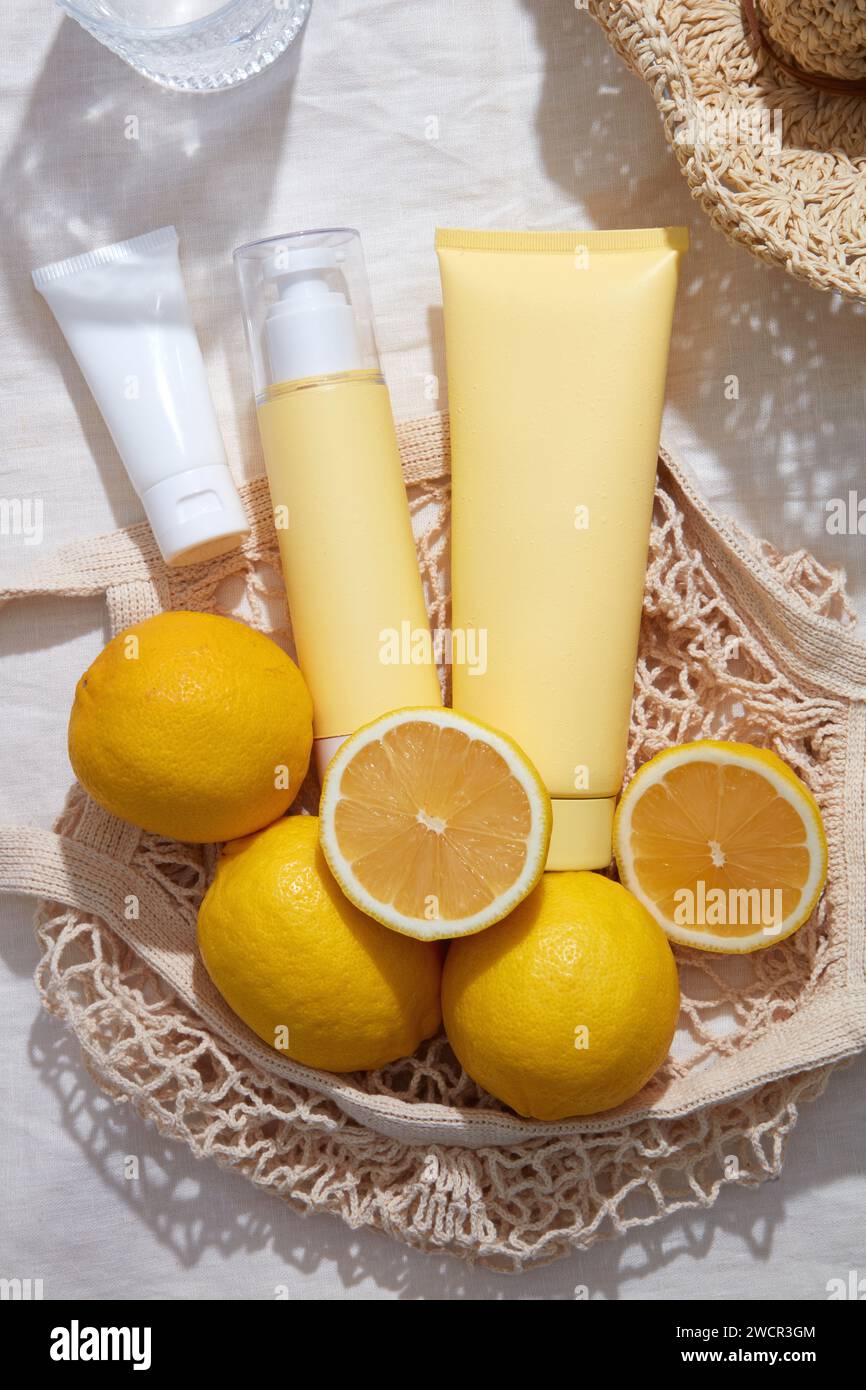 Blank label tube and bottle in yellow color decorated with lemons ...