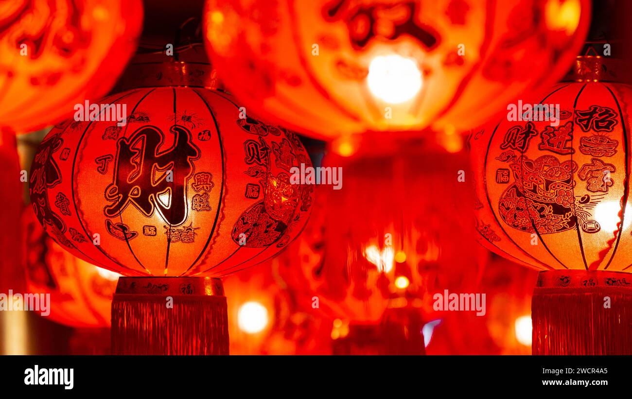 Traditional Chinese red lanterns hanging in the small alley Stock Photo ...