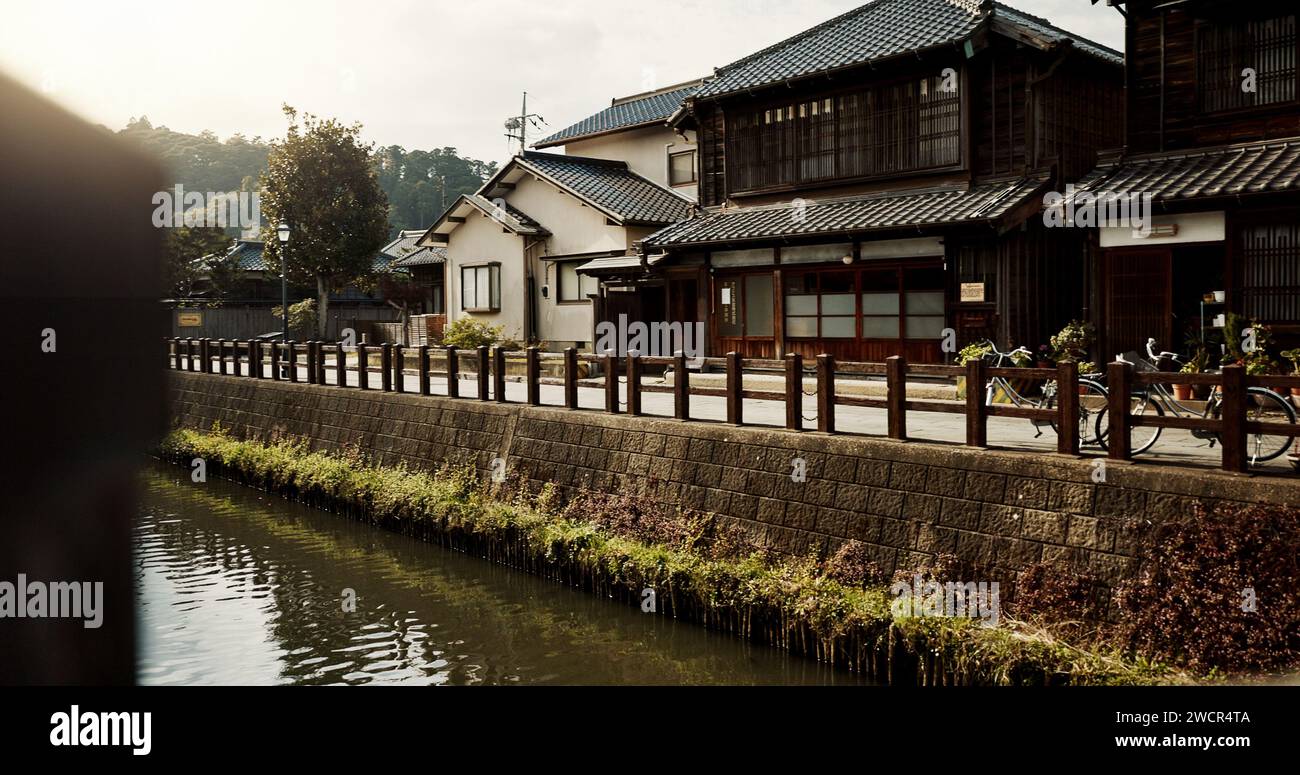 Houses, building and canal with trees in Japan of architecture ...