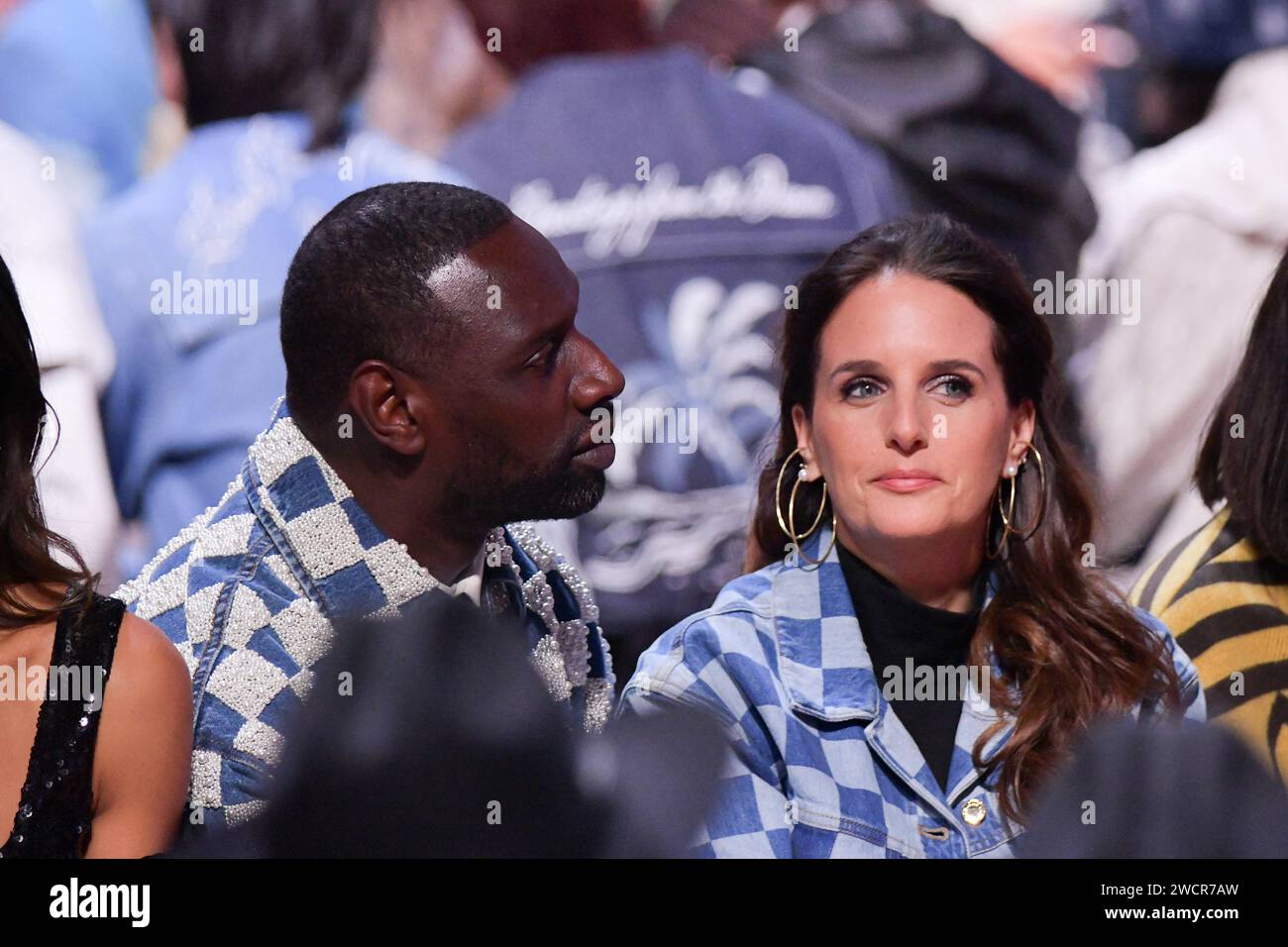 Paris, France. 16th Jan, 2024. Omar Sy, and Helene Sy, his wife, front ...