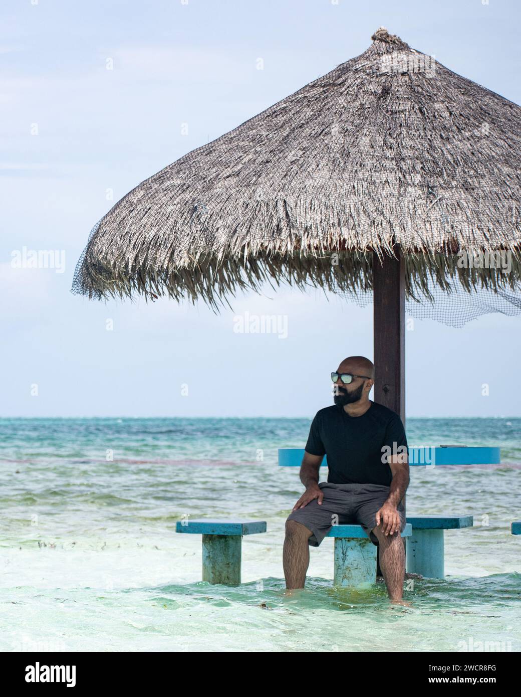 A picture of an Indian bald guy with beard in Maldives and enjoying his ...