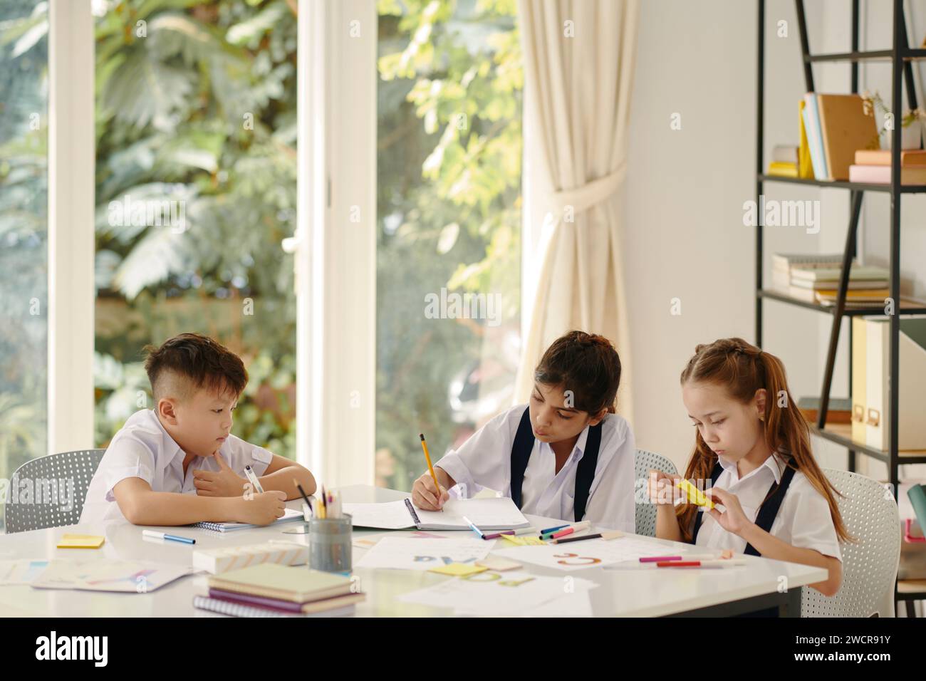 Group of kids practicing writing letters of English alphabet Stock ...