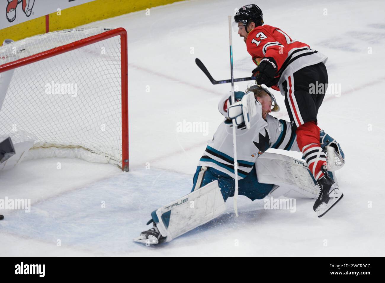 Chicago Blackhawks' Zachary Sanford (13) collides with San Jose Sharks ...