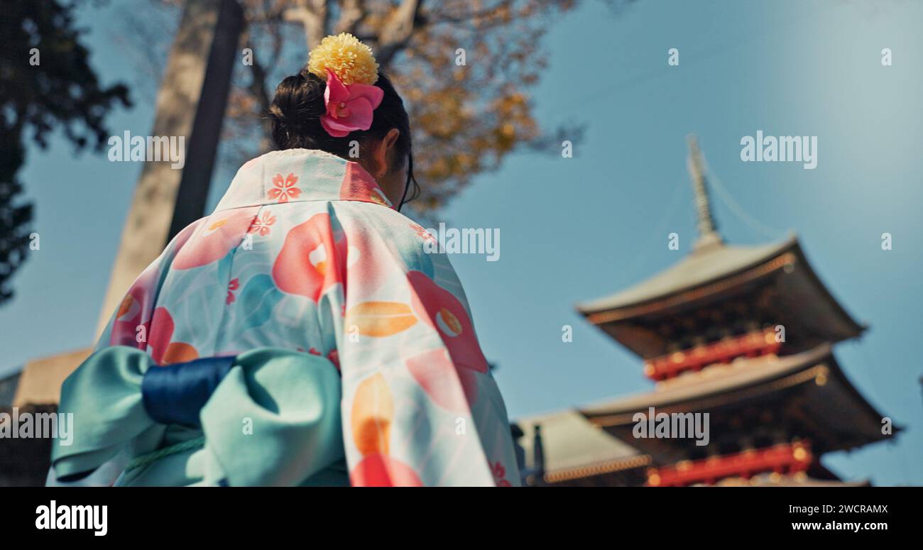Woman, shinto temple and back with traditional clothes in culture ...