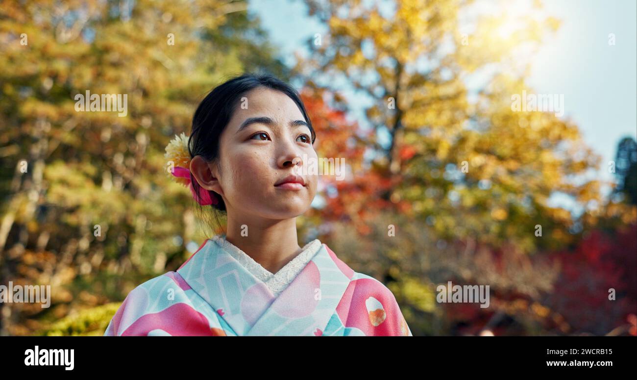 Woman in garden, Asian and calm with fan, thinking about life with ...