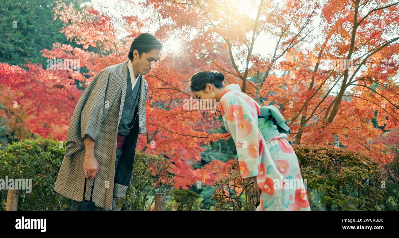 People in park in Japan, bow and traditional clothes with hello, nature ...