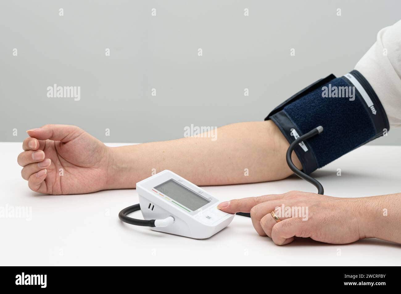 Man using blood pressure hi-res stock photography and images - Alamy