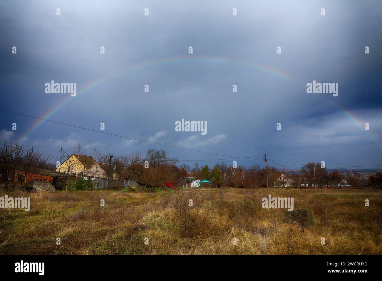 Seasonal landscape in country with rainbow Stock Photo - Alamy