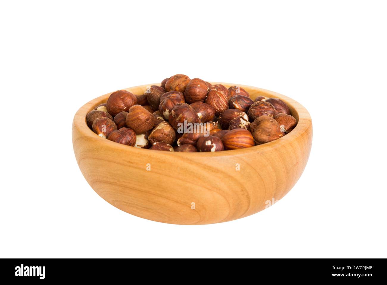 Roasted hazelnut in bowl isolated on white background. hazelnut is ...