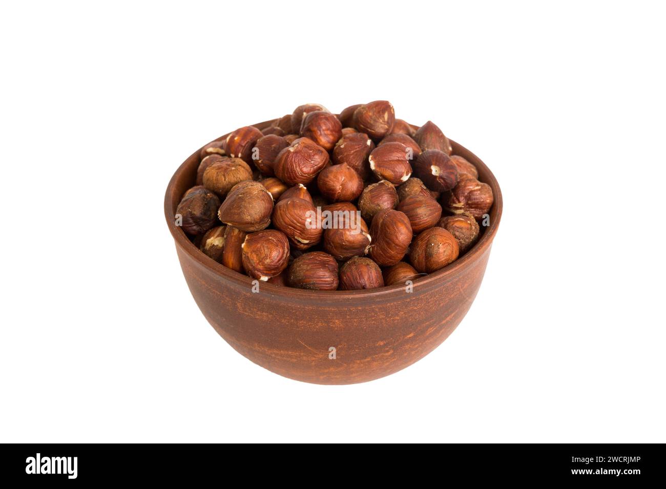 Roasted hazelnut in bowl isolated on white background. hazelnut is ...