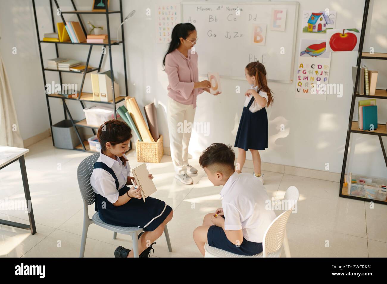Kids learning English alphabet in class, primary school concept Stock ...