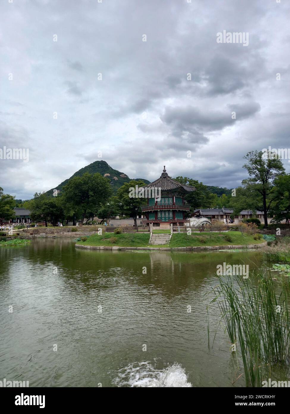 The view of Hyangwonjeong Pavilion surrounded by tranquil water and ...
