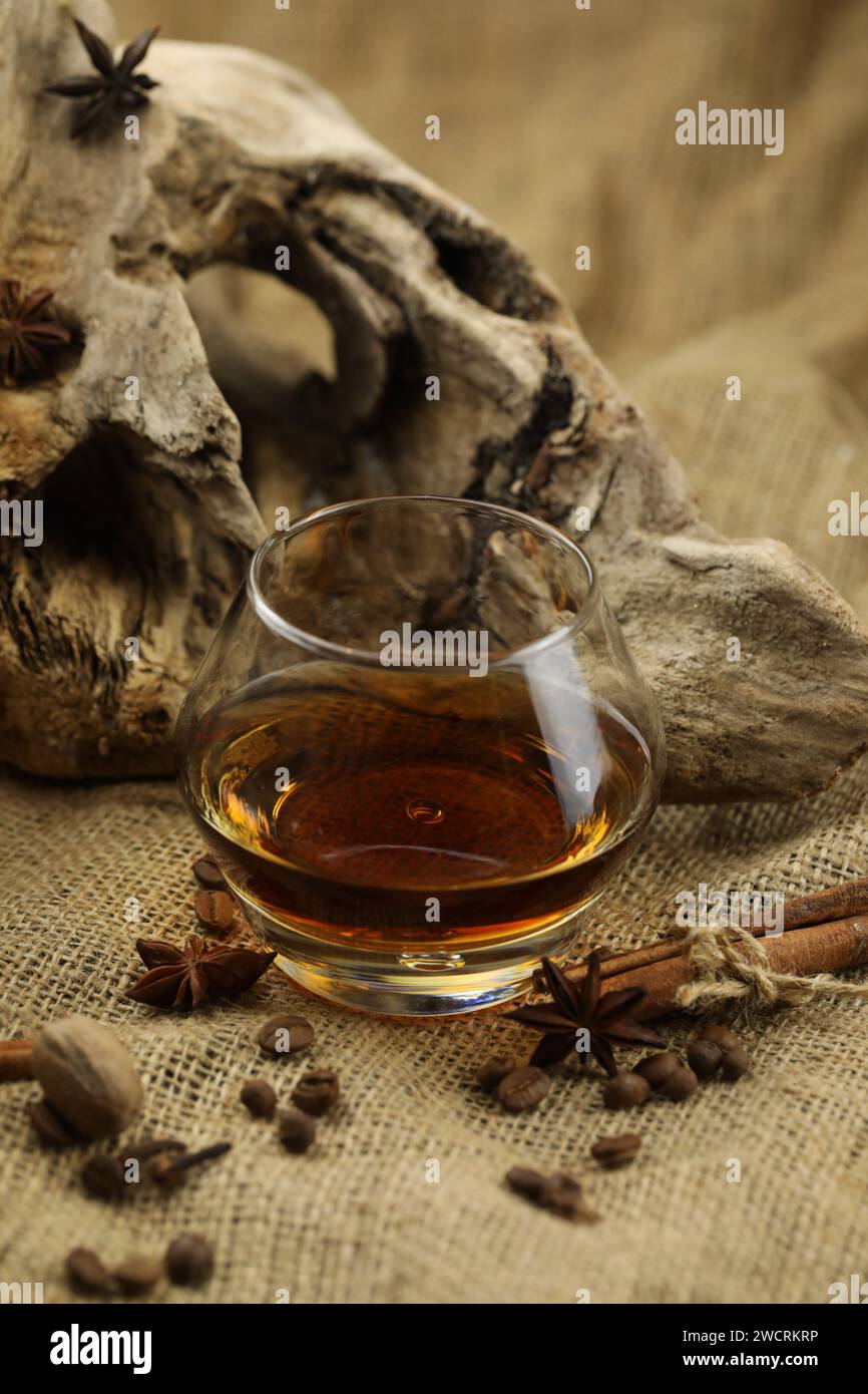 Glass of cognac with spice. Cloth background with copy space Stock ...