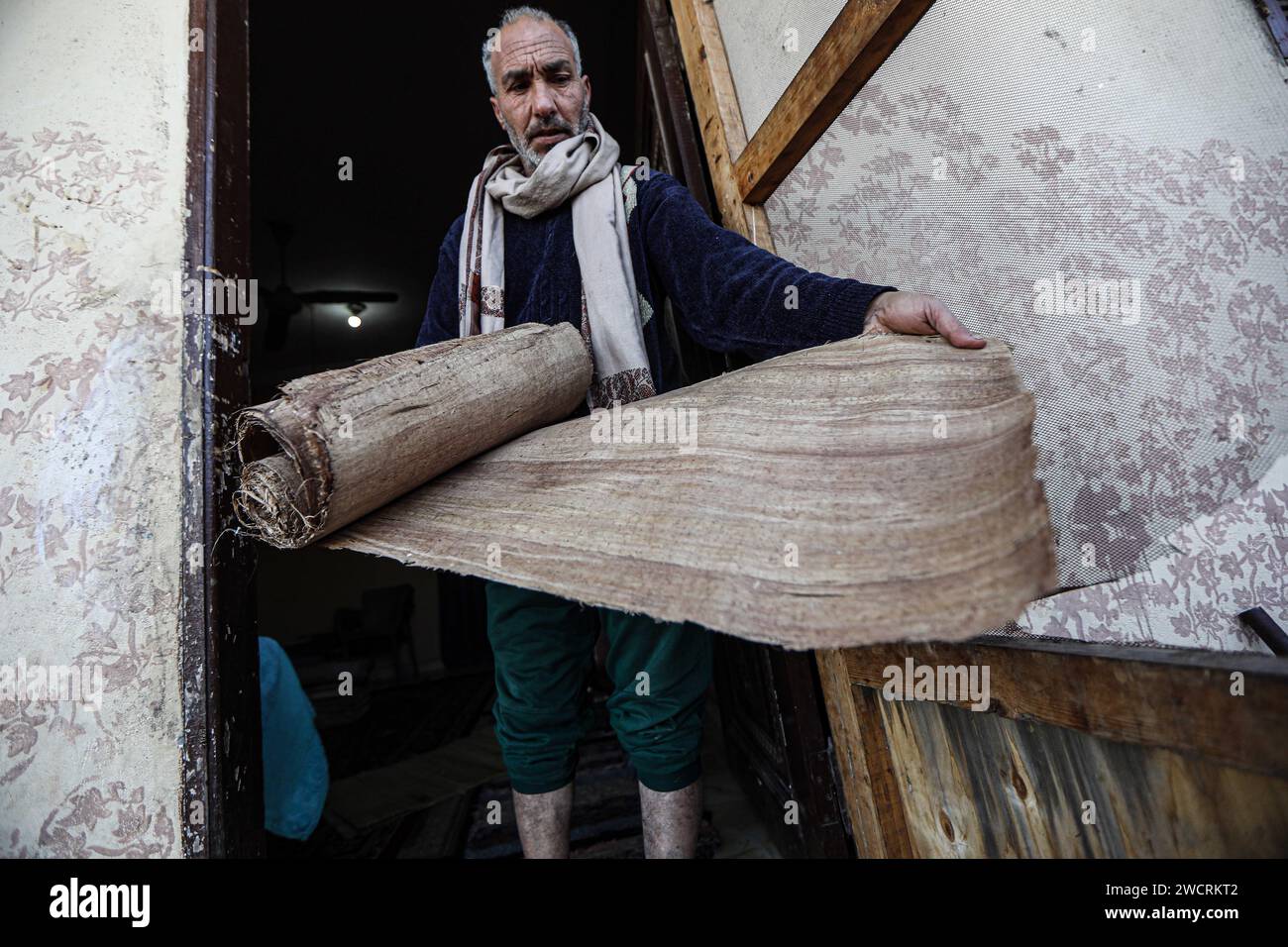 Sharqiya, Egypt. 16th Jan, 2024. Villager Sayed shows papyrus papers at ...
