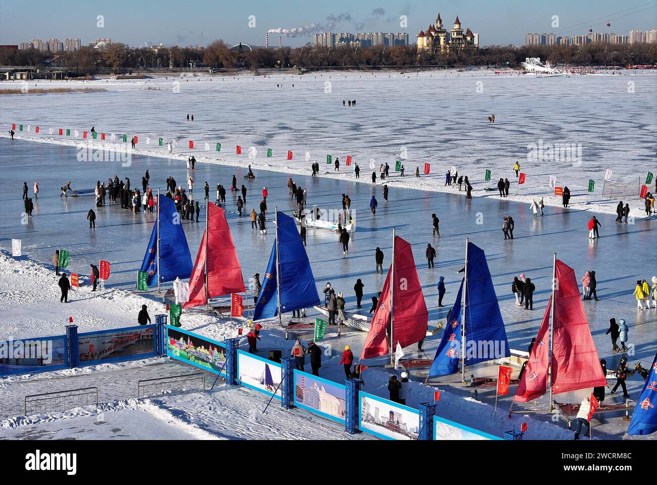 An ice dragon boat race on Songhua River draws tourists in Harbin City ...
