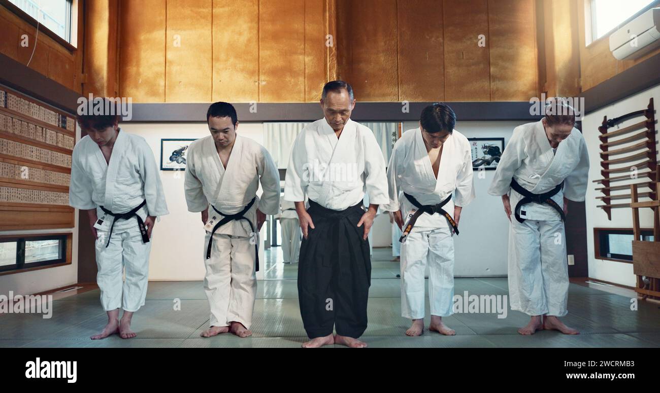 Martial arts group, men and bow at training, respect or honor for fight ...