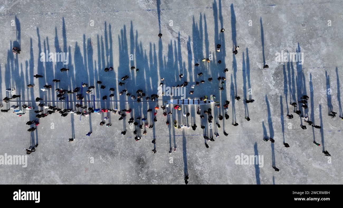 An ice dragon boat race on Songhua River draws tourists in Harbin City ...