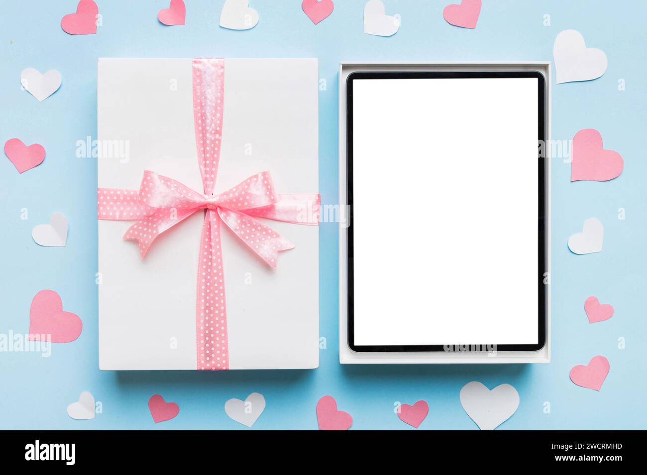 Gift box of open tablet for the holidays with a bow top view Stock ...