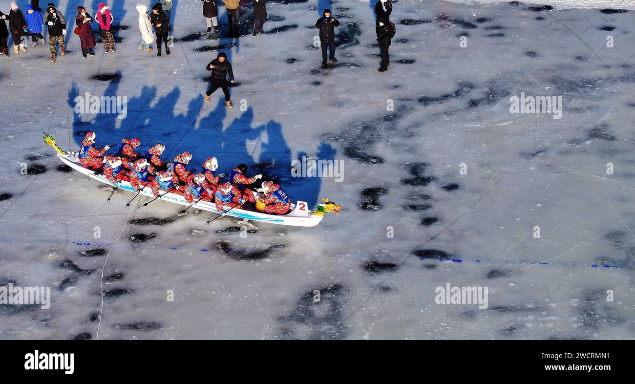 An ice dragon boat race on Songhua River draws tourists in Harbin City ...