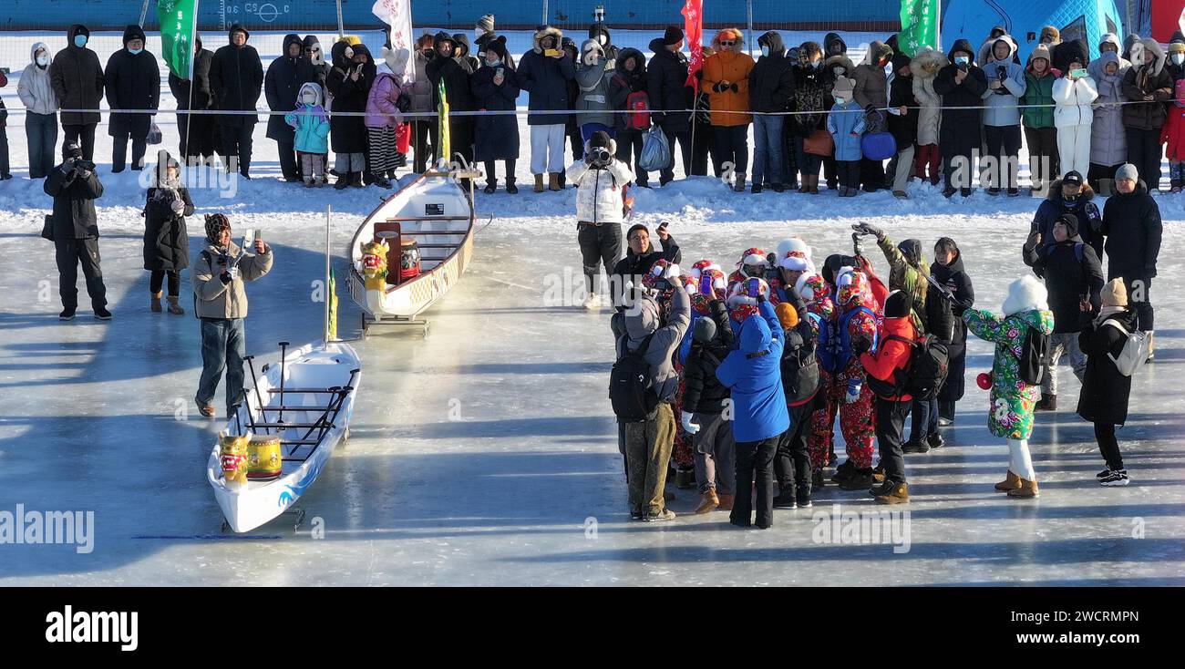 An ice dragon boat race on Songhua River draws tourists in Harbin City ...