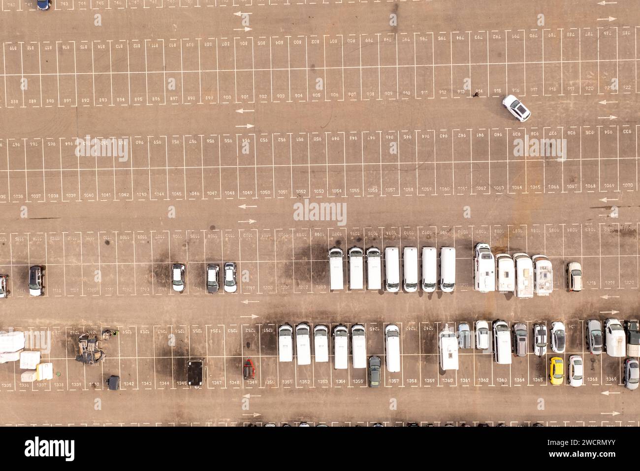 Drone photography of large car park lot with parked cars during autumn ...