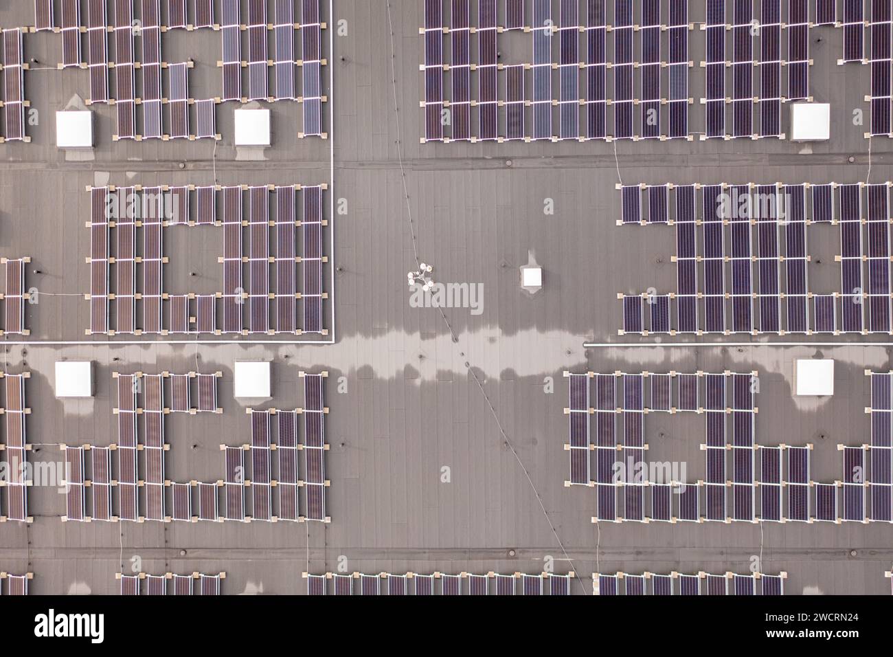 Drone photography of logistical warehouse with solar panels on the roof ...